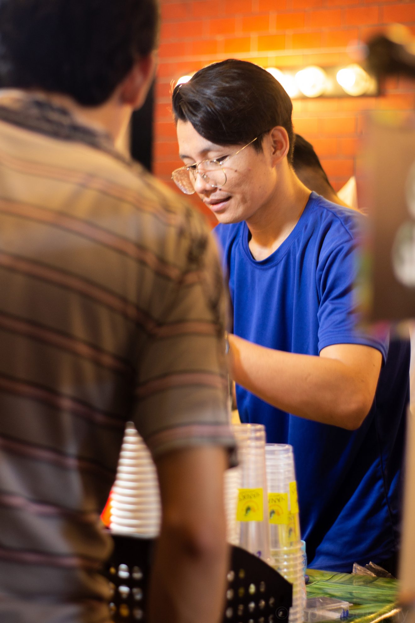 Man Selling Drinks Happily - Exibart Street