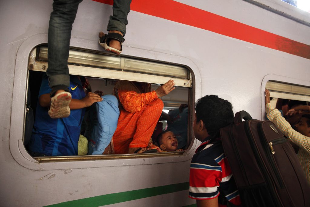Passengers riding trains through the window for challenging journey-09 ...